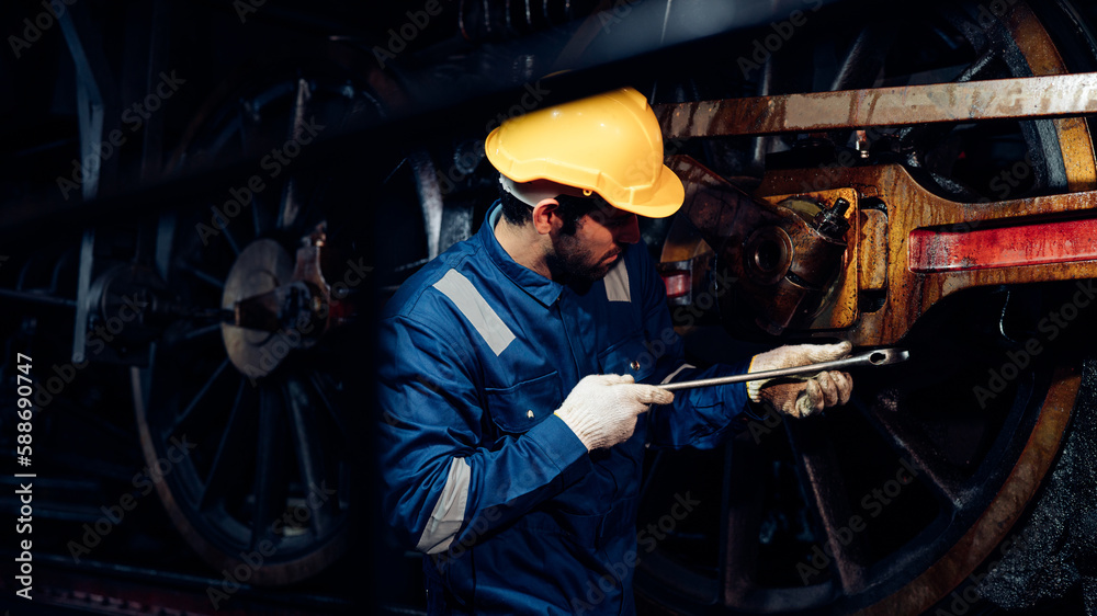 Engineer railway wearing safety uniform and helmet under checking under ...