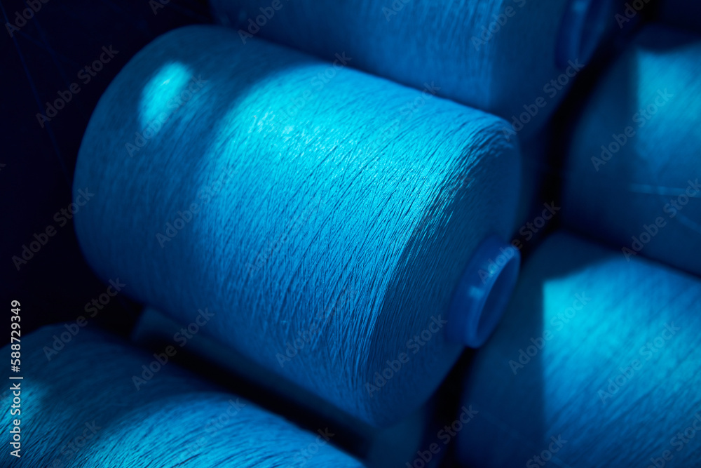 Blue rolls of industrial cotton in weaving factory, hand weaving cotton ...