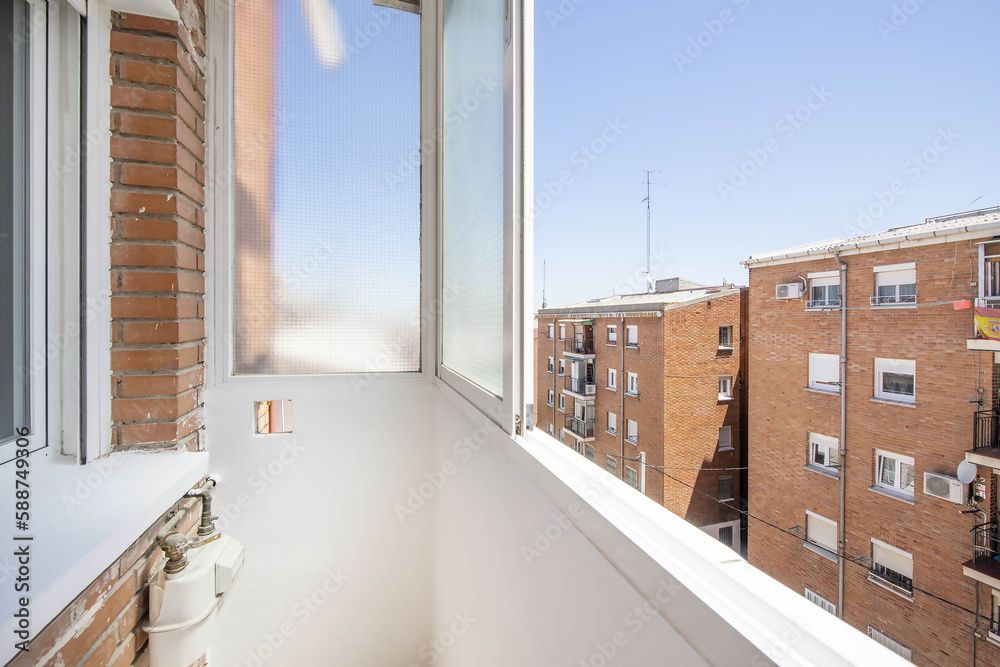 Small viewing terrace of a house with white aluminum sliding windows ...