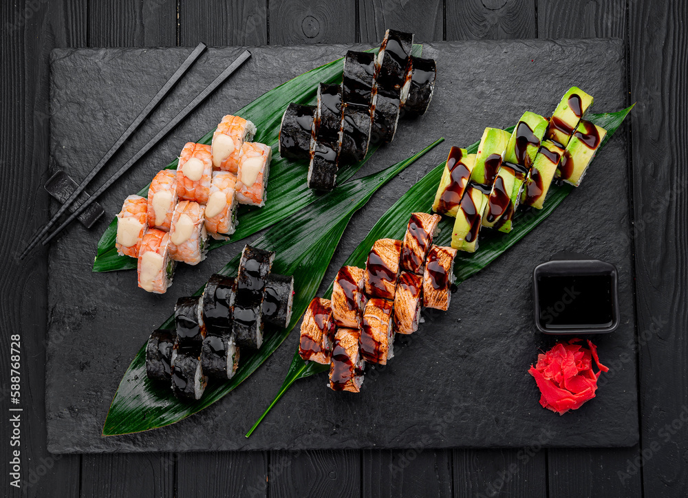 Assorted sushi nigiri and maki big set on slate. A variety of Japanese ...