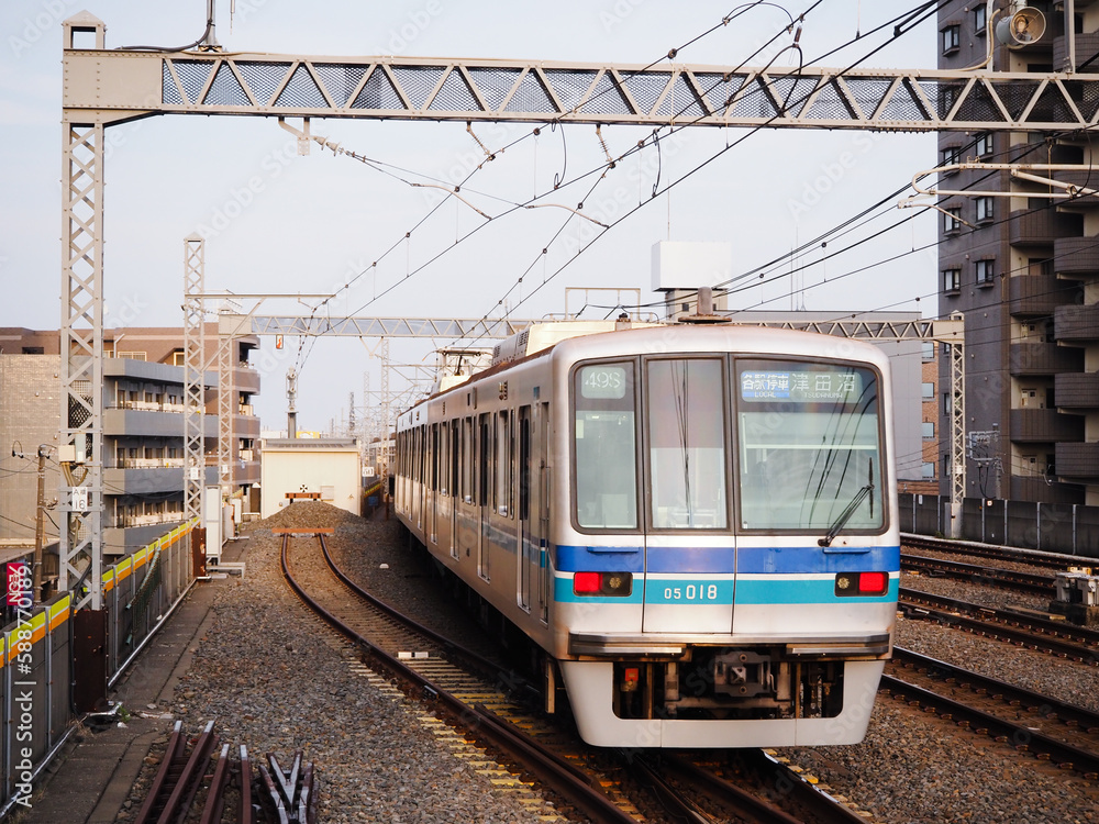 TOKYO, JAPAN - April 4, 2023: A subway train leaving Kasai subway ...