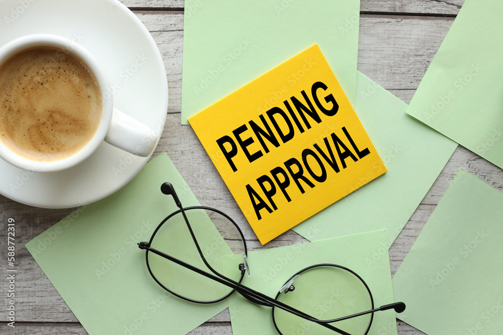 colorful note paper with pending approval text pinned to wood texture ...