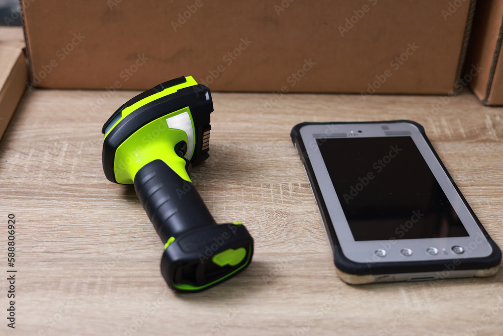 Green bar code scanner and mini tablet using in warehouse logistic ...