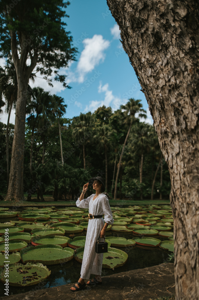 Young lady walking in Sir Seewoosagur Ramgoolam botanical garden in ...