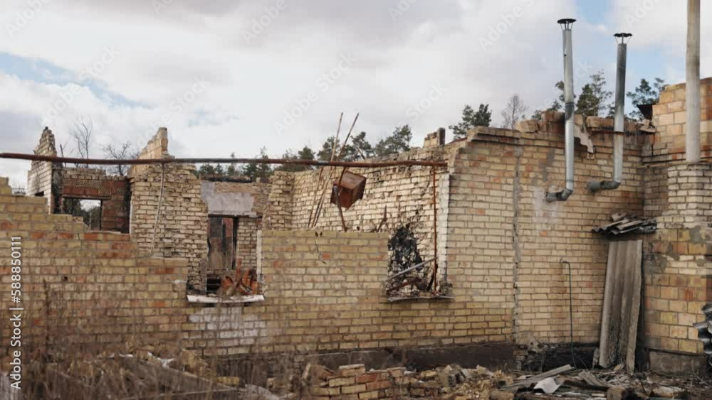 burned houses, War in Ukraine, destroyed building. Collapsed building ...