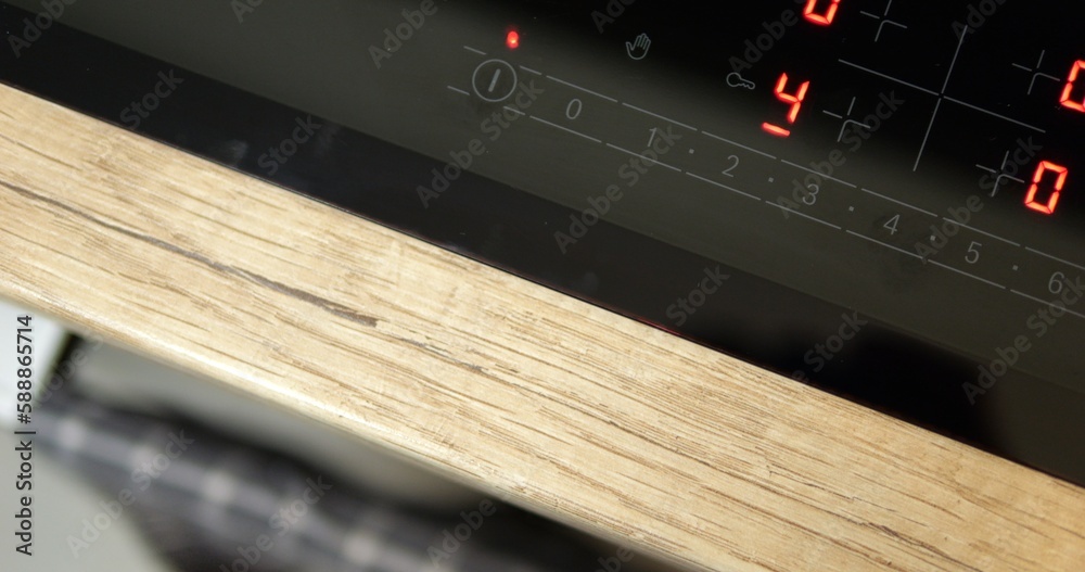 Top view of turned on control panel indicator black induction cooktop ...