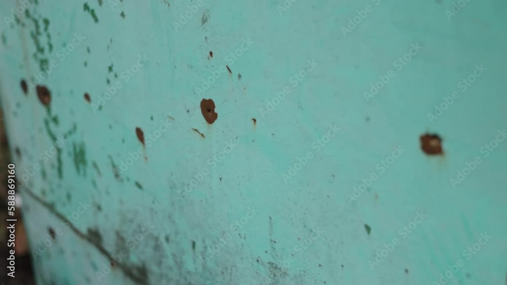 after shelling, Shot holes, metal fence. Destroyed metal fence with ...