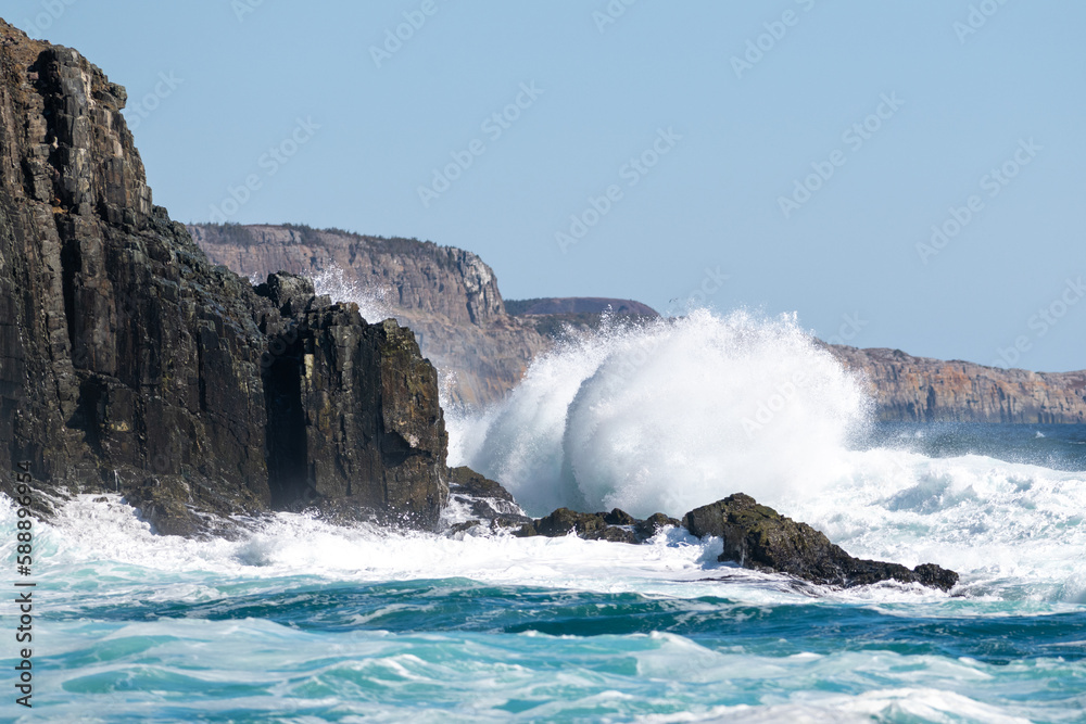 An angry turquoise green color massive rip curl of a wave as it barrels ...