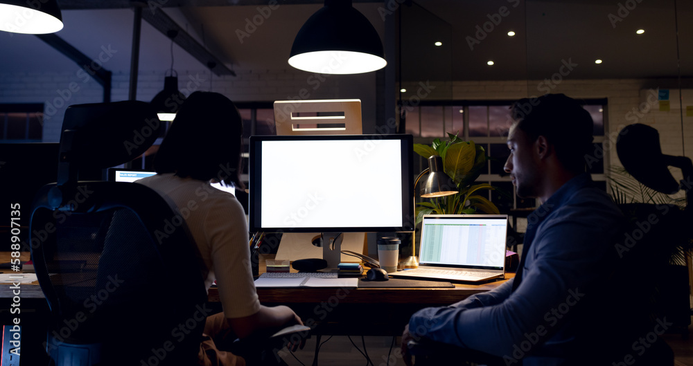 Diverse business people at desk, using computers with copy space on ...