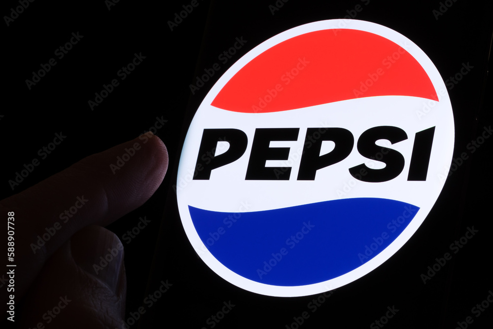 PEPSI new logo introduced in 2023 seen on the screen glowing in the ...