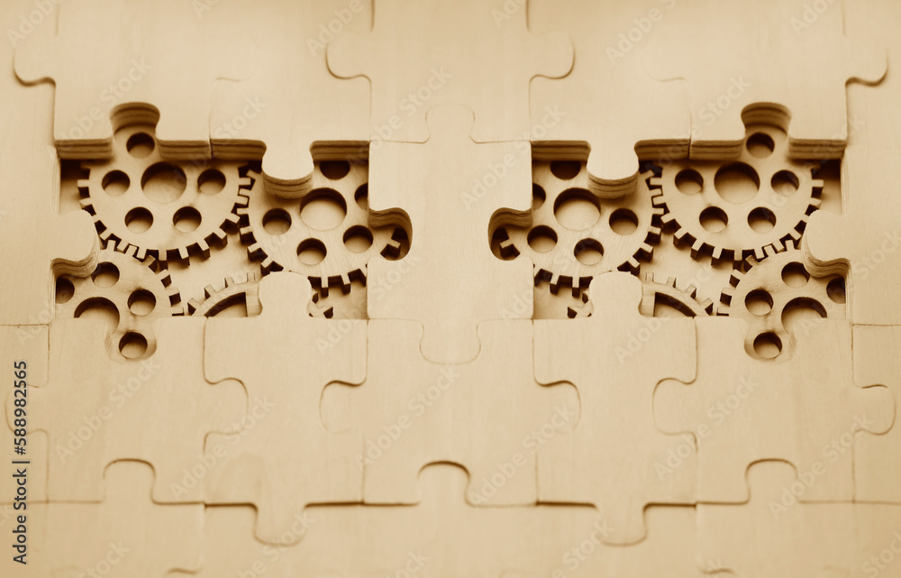 solving the problem concept - puzzles and cogwheels. wooden gears under ...