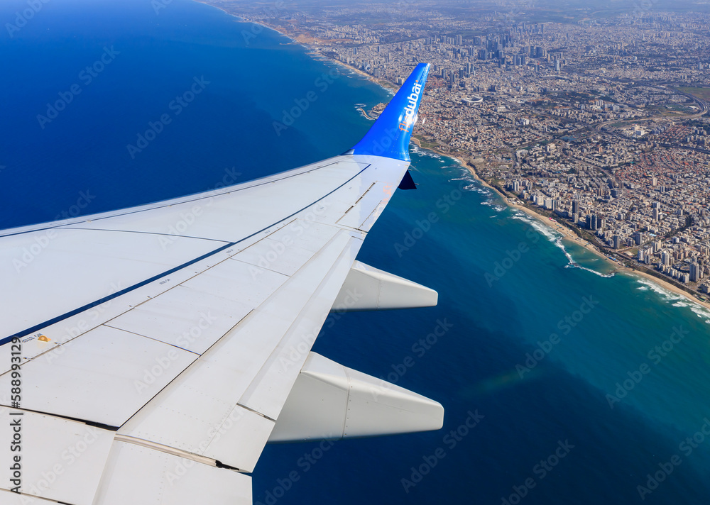 View from the window of a Flydubai plane taking off on buildings in the ...
