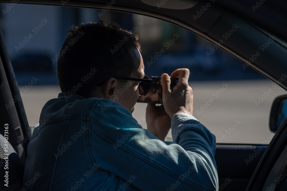Hidden photographing. Paparazzi Concep Photographer uses his ...