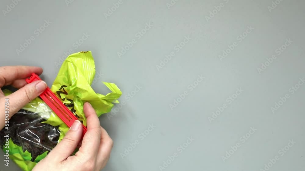 Hands opening Food bag clips for keeping food fresh,plastic bag clips ...