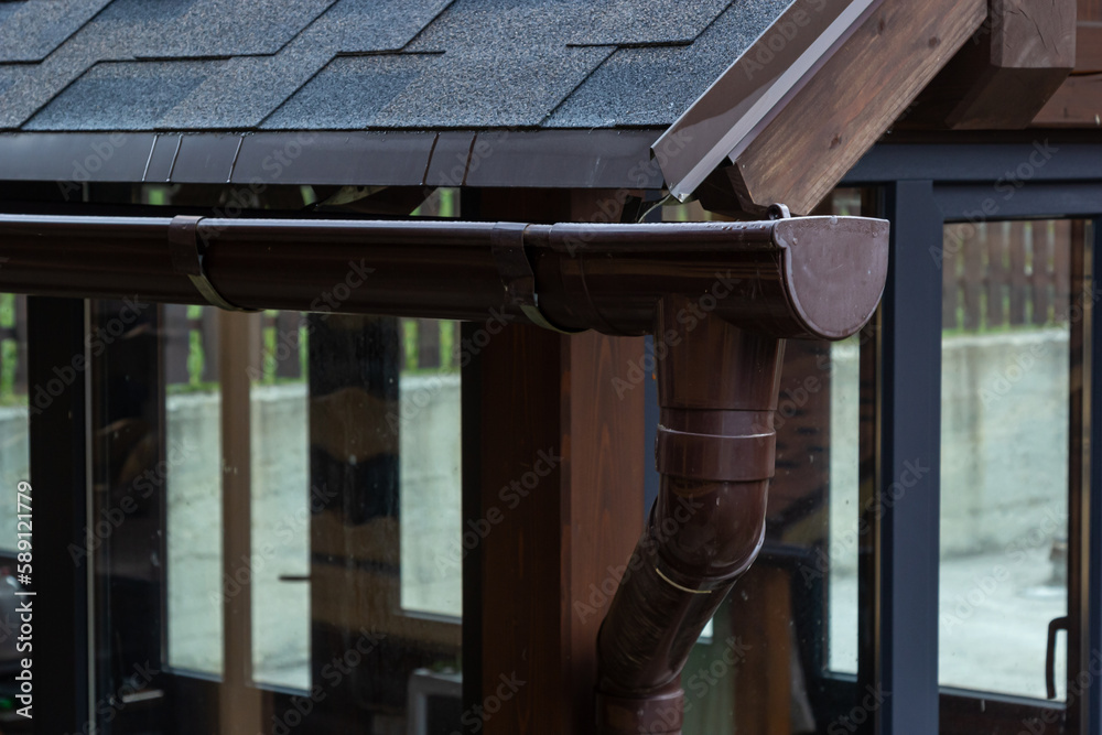 Holder gutter drainage system on the roof. Drain on the roof of the ...