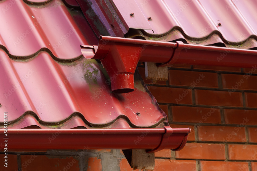 Holder gutter drainage system on the roof. Drain on the roof of the ...