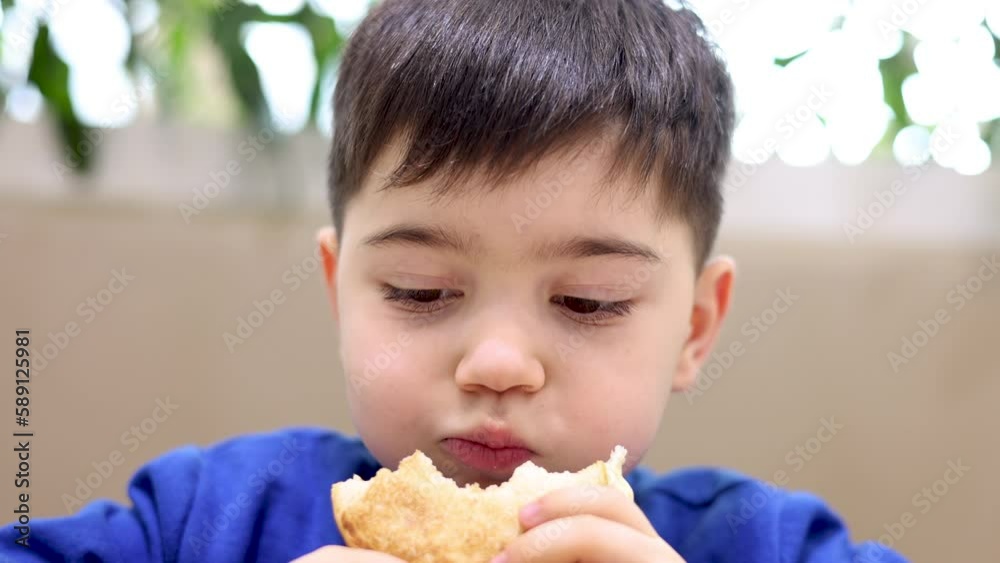 adorable kid boy eating in mall unhealthy junk food snacks.child ...