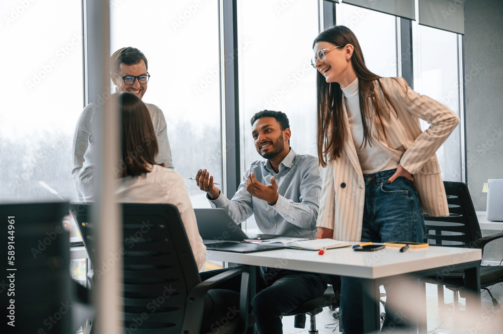 Conception of brainstorming. Four people are working in the office ...