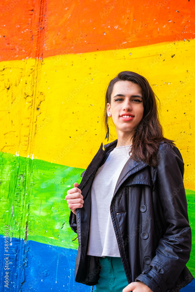 Photograph Of A Transsexual Woman In Front Of A Wall With The Rainbow