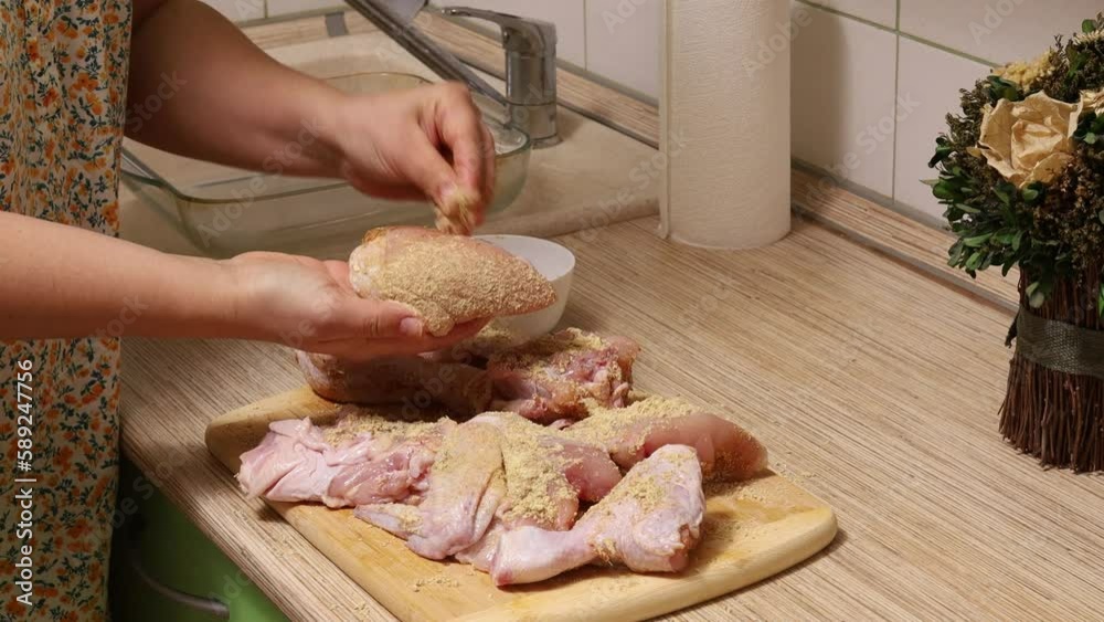Stockvideon Cropped woman in bathrobe cooking breaded chicken cutlets ...