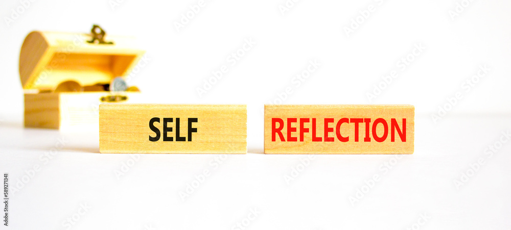 Self reflection symbol. Concept word Self reflection on wooden blocks ...