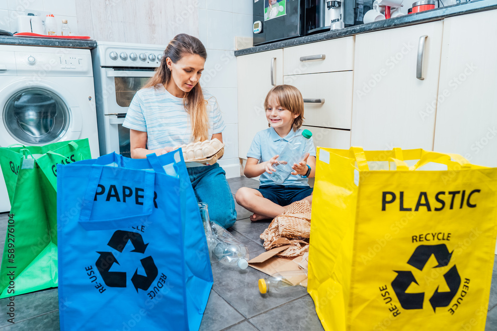 Mother is teaching kid how to recycle help the boy aware environmental ...