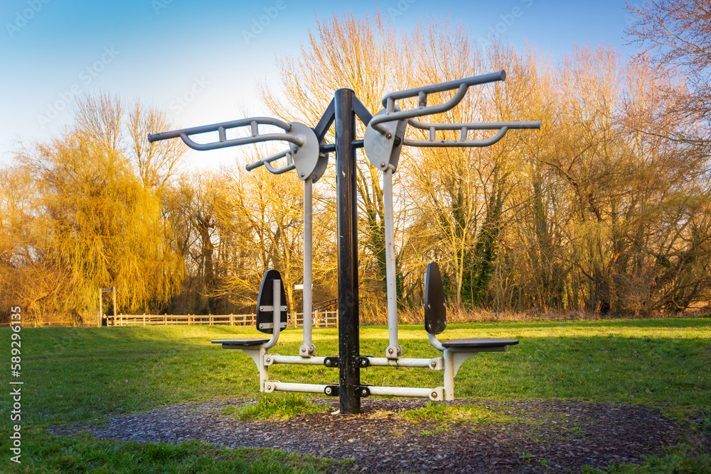 Outdoor gym exercise equipment at public park sports area. Weights ...