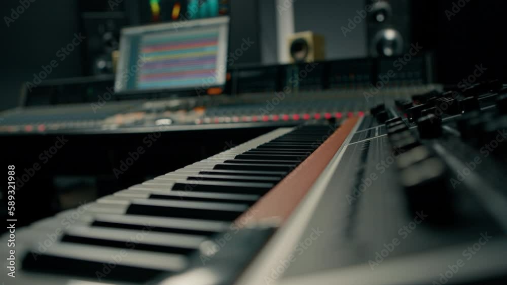 recording studio with a screen with sound wave and volume settings two ...