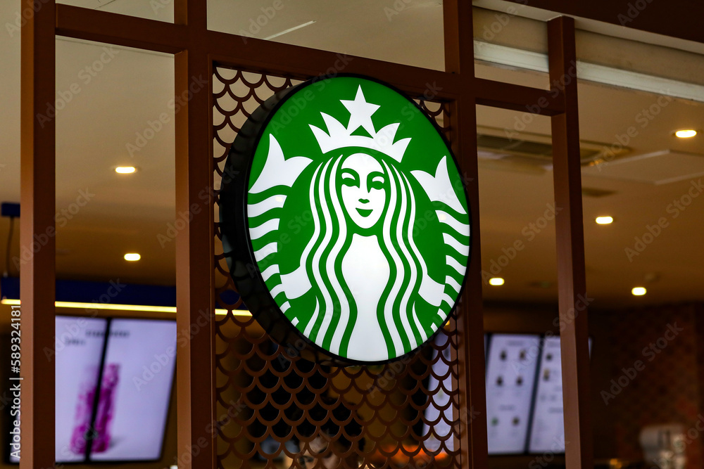 Valencia, Spain: March 18, 2023: Trademark green logo Starbucks with ...