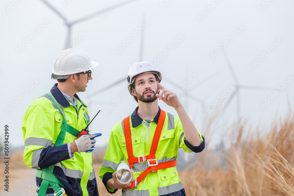 Foto de Teamwork engineer worker wearing safety uniform discuss ...