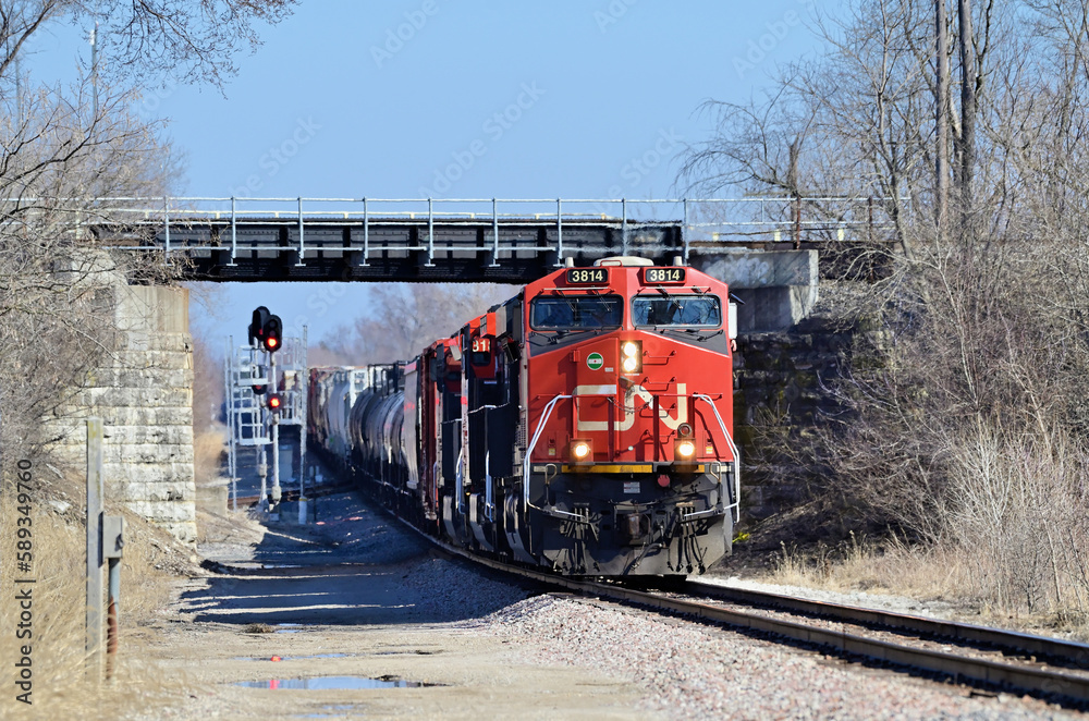 A pair of locomotives power a Canadian National Railway freight train ...