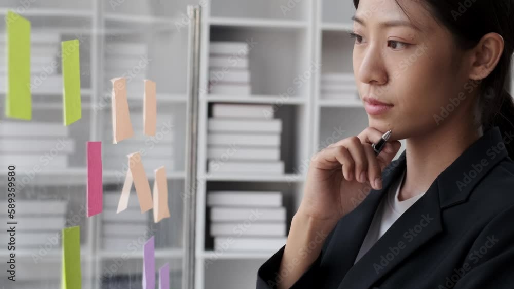 Young woman scheduling work strategy. Business female brainstorming ...