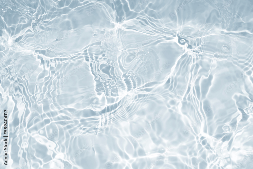 Water waves surface hits the sunlight. Close up swimming pool water ...