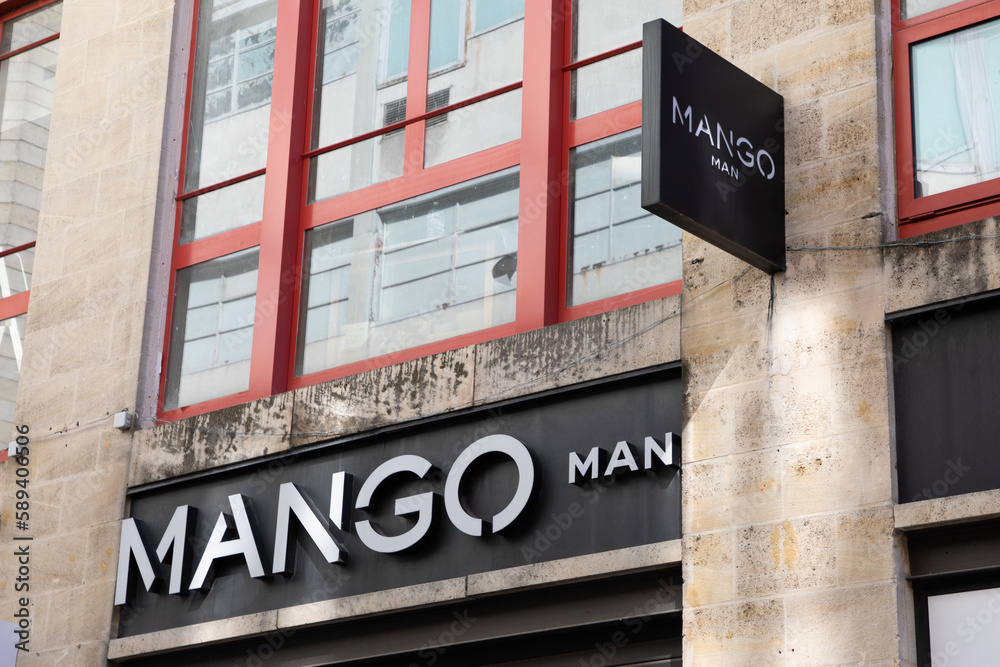 mango man brand logo of Spanish clothing store facade wall shop front ...