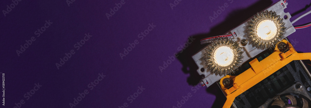 Hand made robot flat lay on the arduino purple background platform. DIY ...