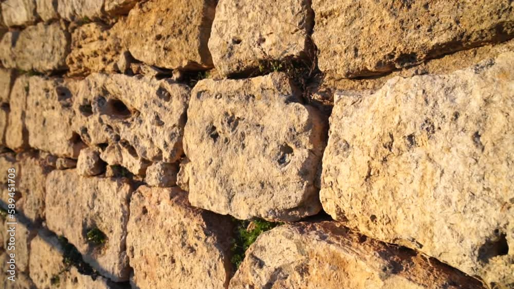 Ancient Stone Wall - Limestone. Fence is made of crude stone limestone ...