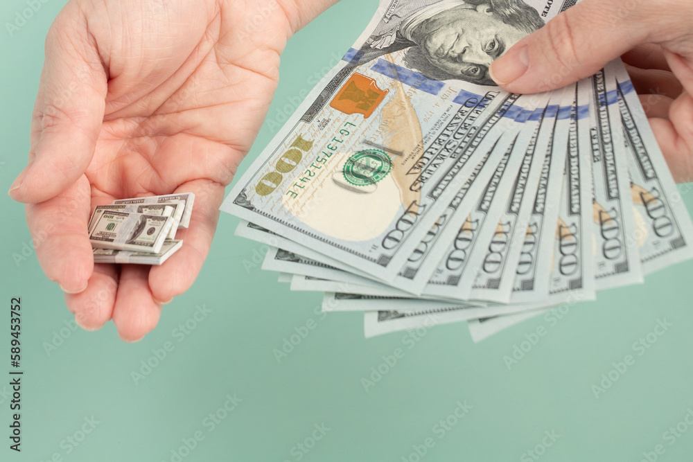 small and big money in hands, comparison of dollars before inflation in ...
