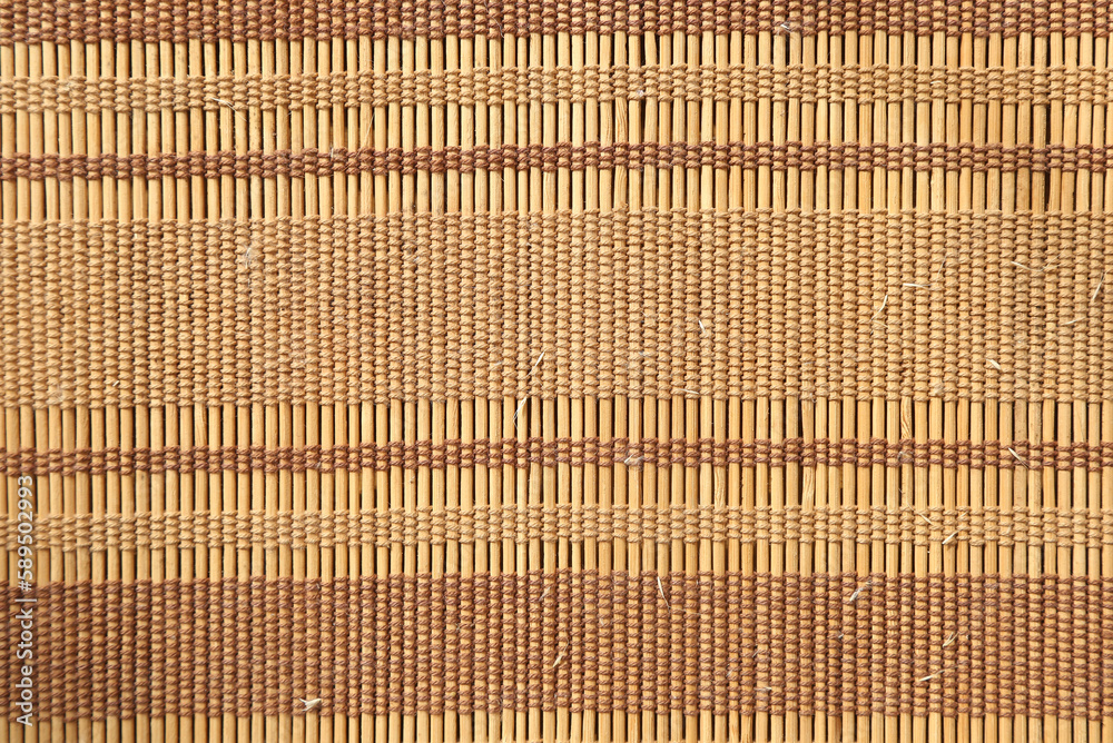 background texture, a rug of bamboo sticks, wooden sticks rewound with ...