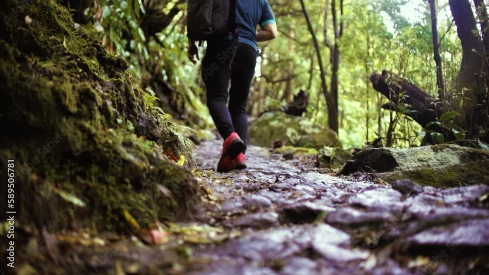 Track trail through mountains walking by muddy paths after rain amidst ...