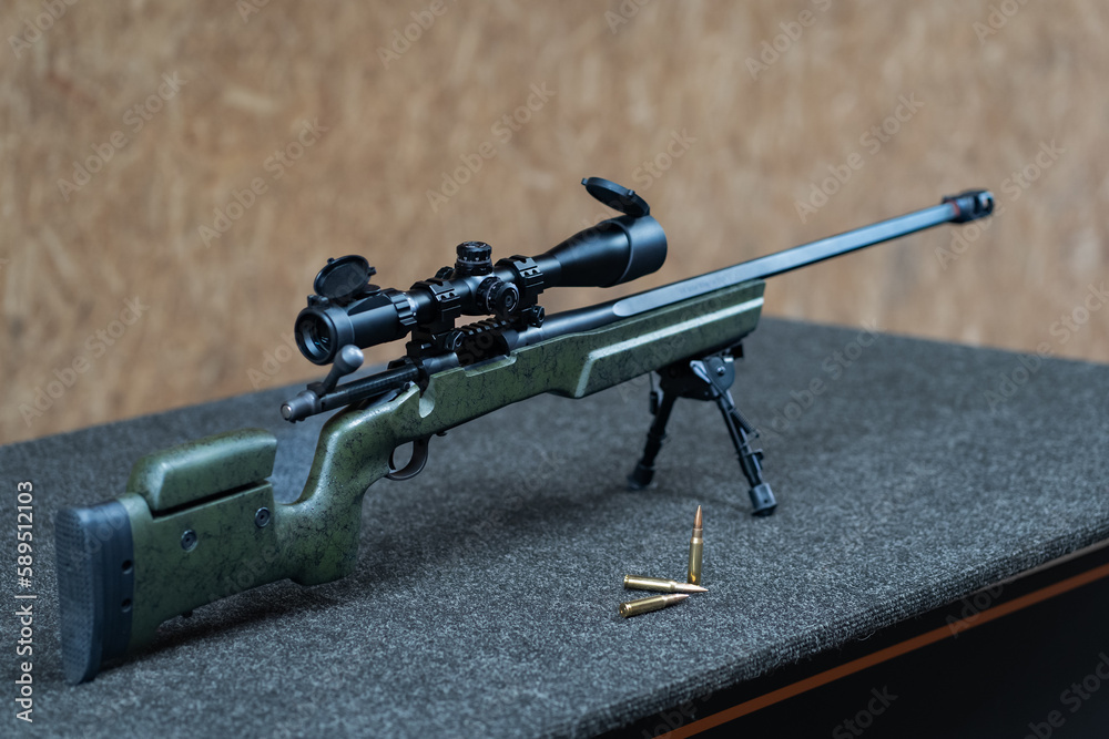 Cool American bolt action sniper rifle with a telescopic sight, close ...