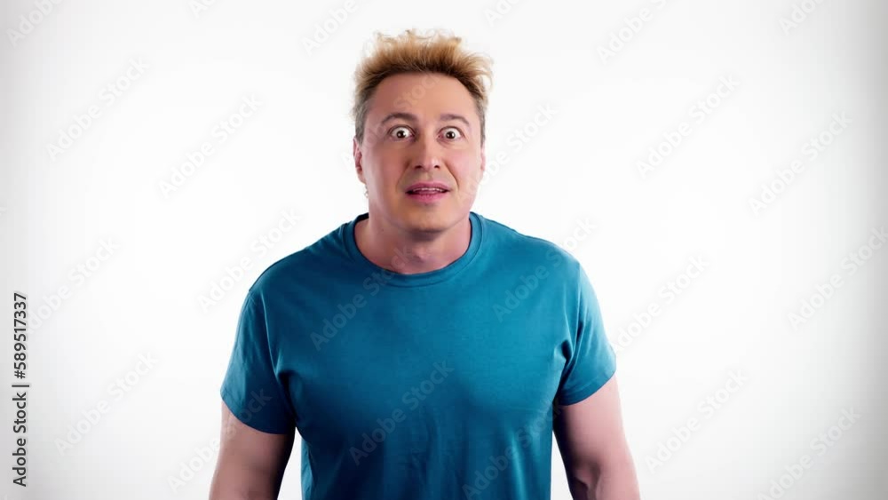Vidéo Stock Surprised man with amazed wow expression. Excited guy with ...