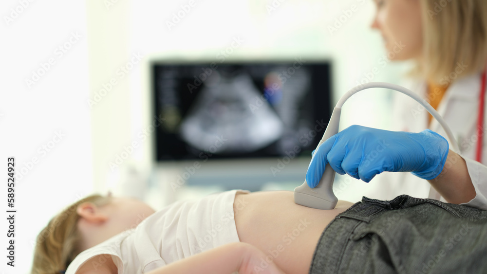 Doctor gastroenterologist making ultrasound examination of liver and ...