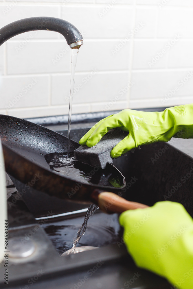 Person in Green Glove Washing Frying Pan with Sponge under Running ...