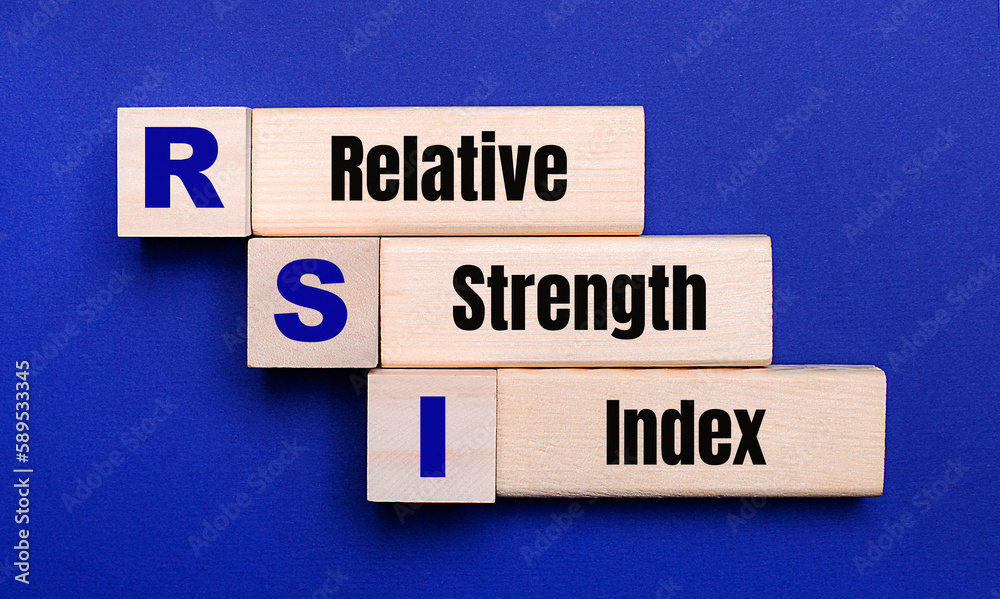 On a bright blue background, light wooden blocks and cubes with the ...