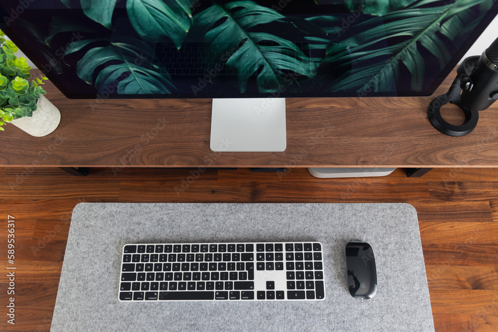 LONDON - APRIL 06, 2023: Minimal desk setup in modern home office with ...
