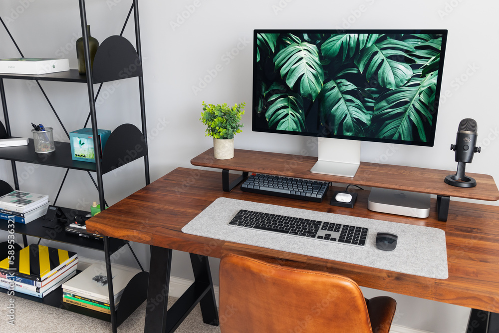 LONDON - APRIL 06, 2023: Minimal desk setup in modern home office with ...
