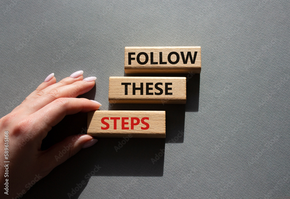 Follow these steps symbol. Wooden blocks with words Follow these steps ...