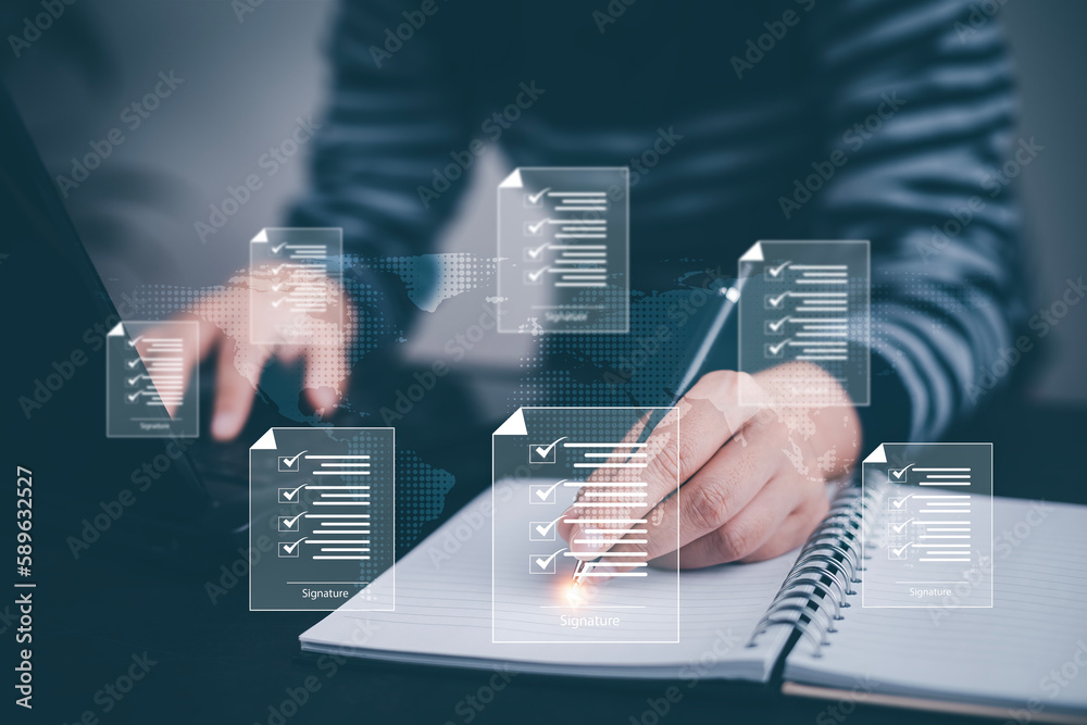 Signing electronic documents on digital documents Online, a businessman ...