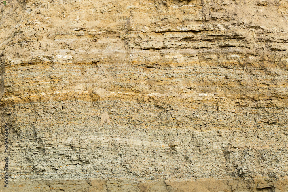 Sedimentary rocks with a high content of iron oxide. Red soil, loam ...