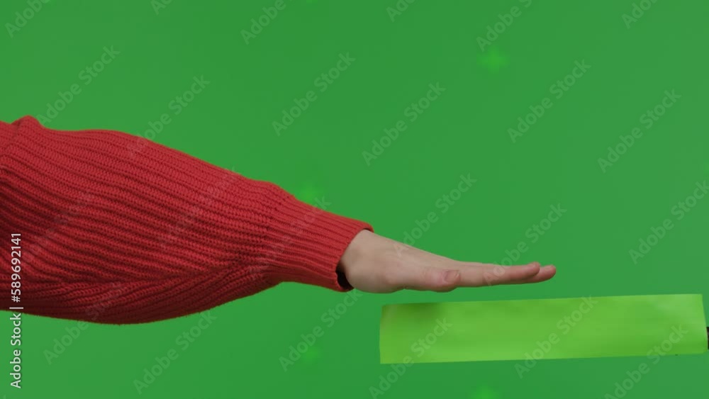 Close up side view of female hand laying on something imaginary virtual ...